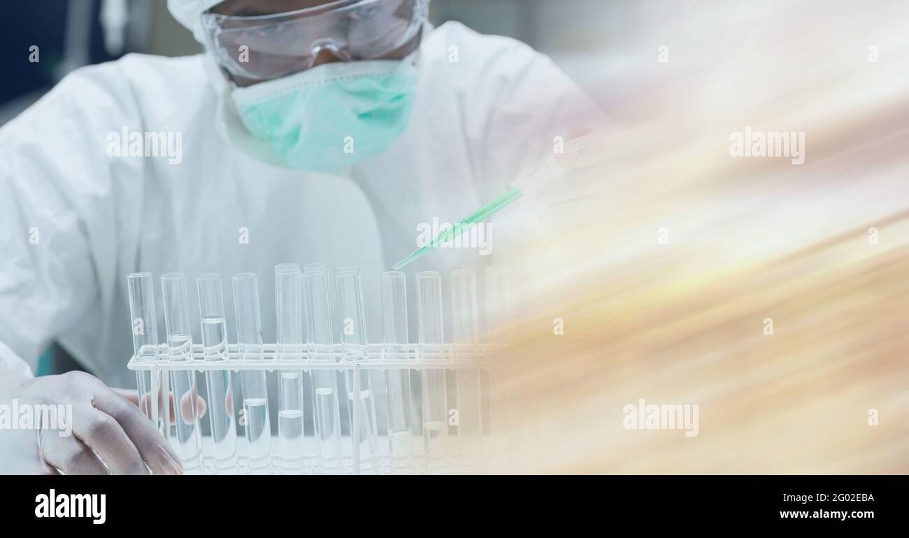 Composition of scientists in ppe suit with test tubes working in ...