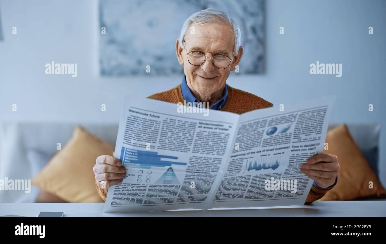Grandpa reading newspaper hi-res stock photography and images - Alamy