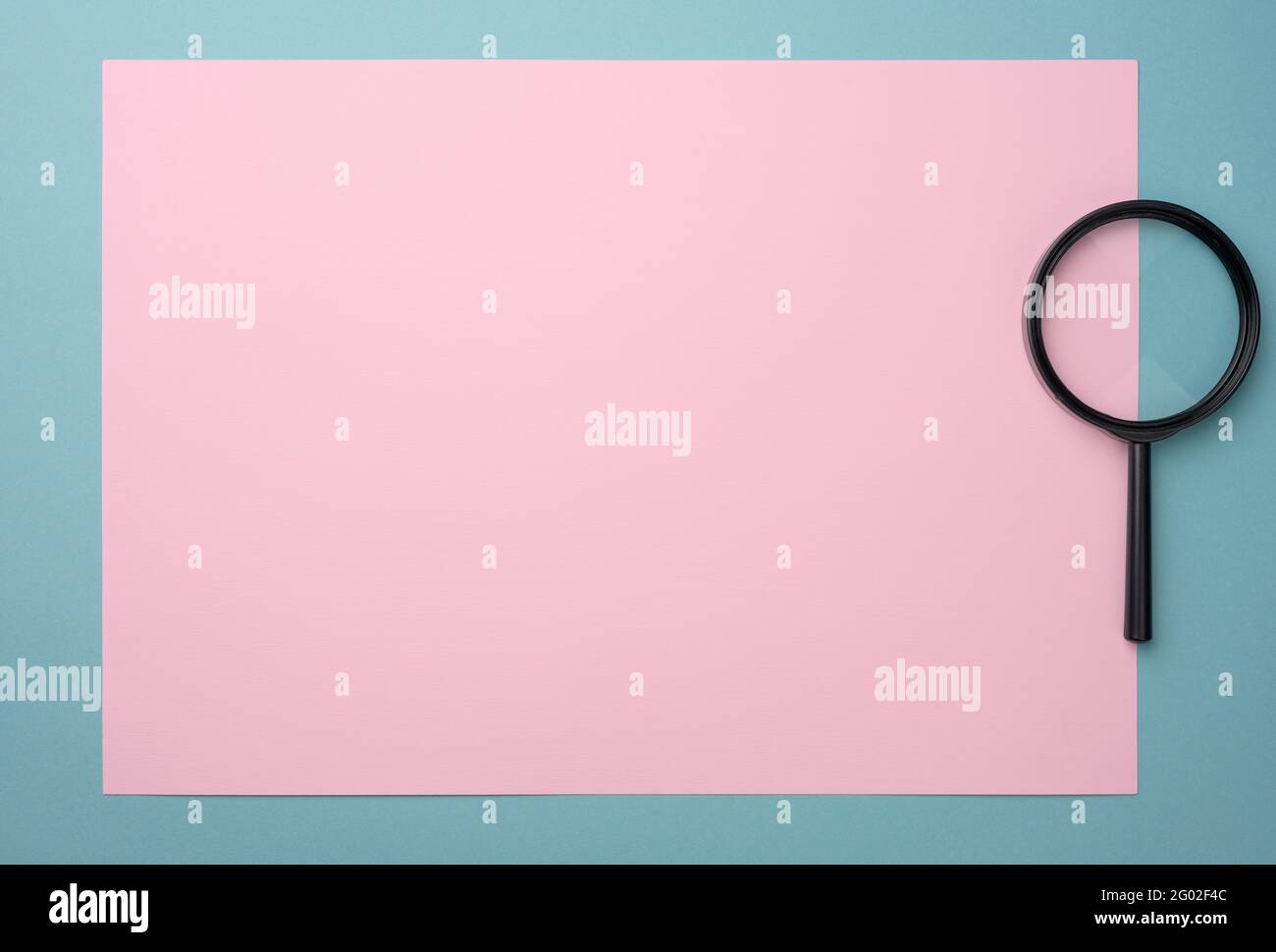black magnifier on a pink-blue background. The concept of uncertainty ...
