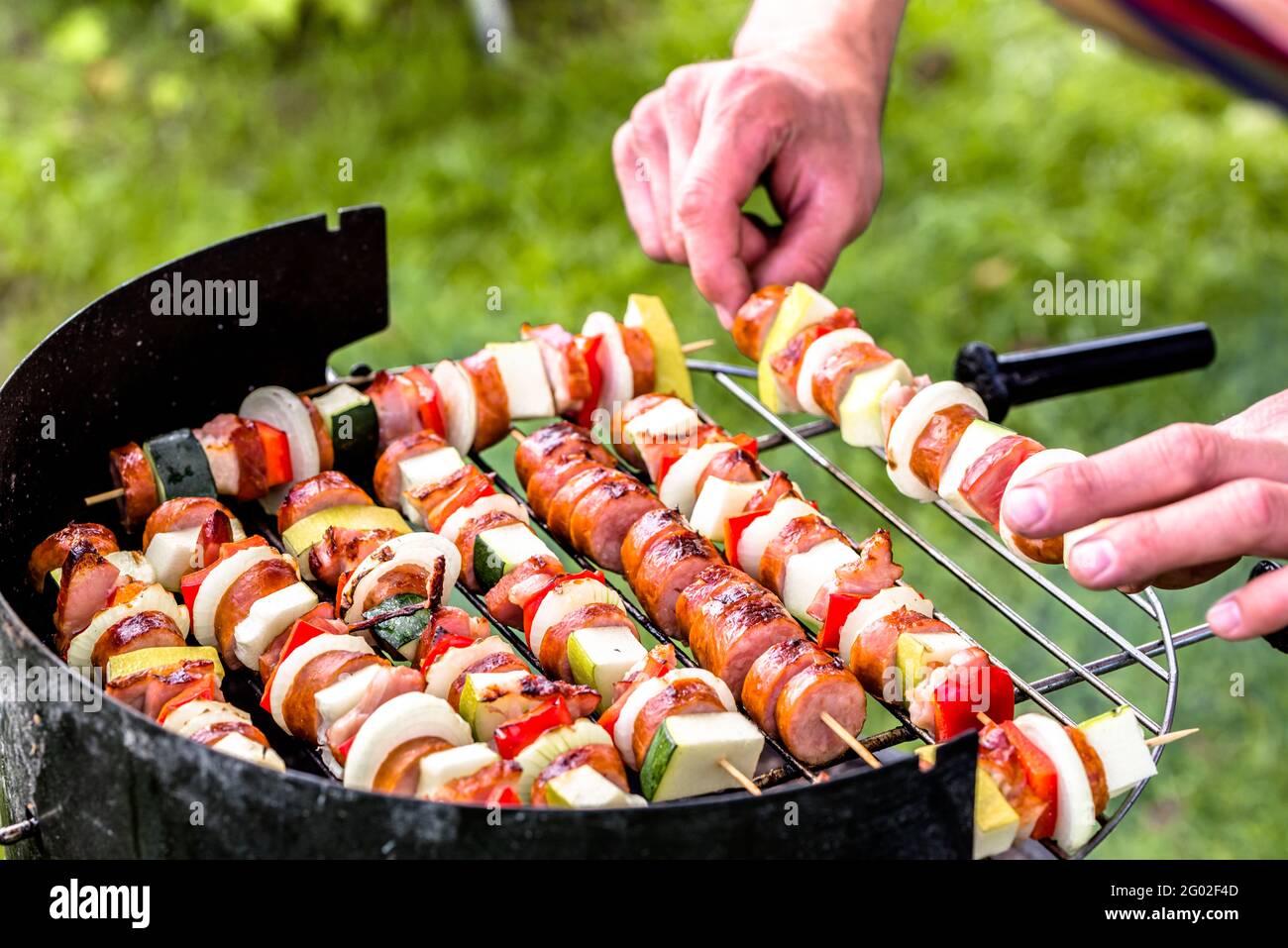 Family meal outside hands hi-res stock photography and images - Alamy