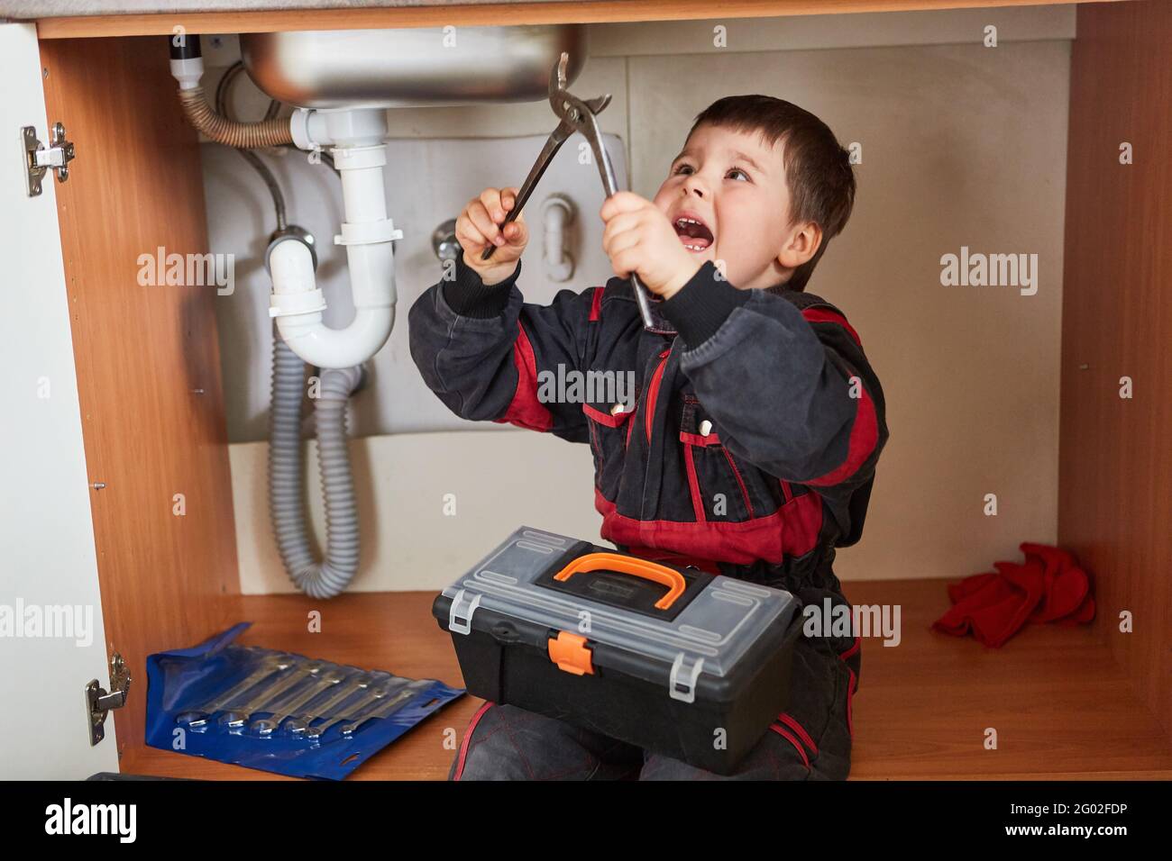 Boy in sink hi-res stock photography and images - Alamy