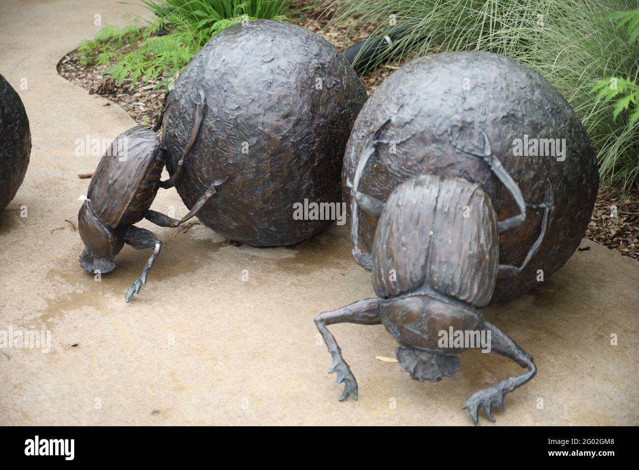Closeup shot of a monument of bugs coming out of a globe in Topeka zoo ...