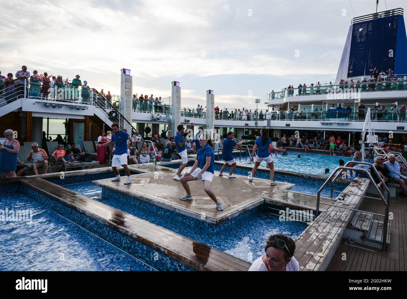 Cruise ships Azura and Britannia dancing singing staff on ships people ...