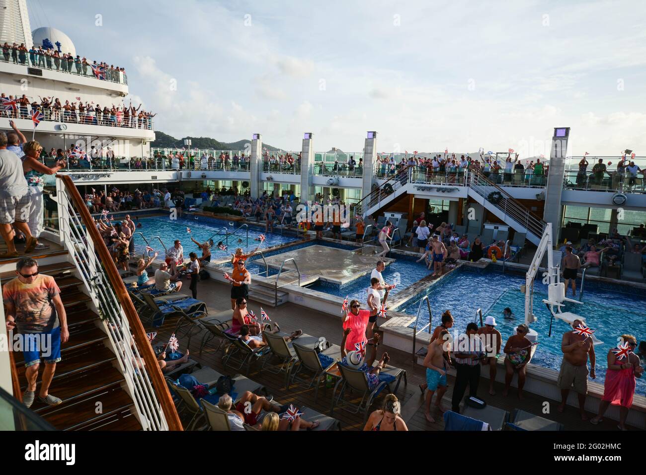 Cruise ships Azura and Britannia party waving singing people swimming ...