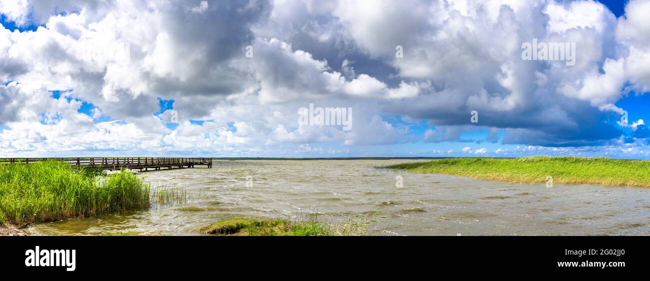 Panorama of lake, natural landscape with reservoir of water and grass ...