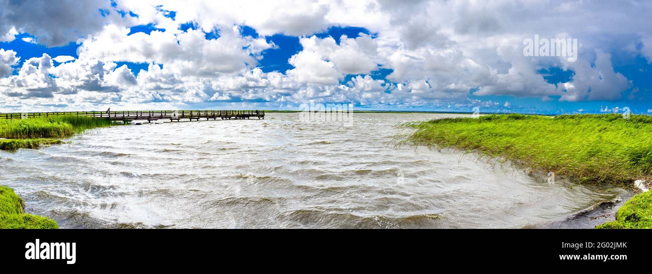 Big lake, panorama, natural landscape with reservoir of water and grass ...