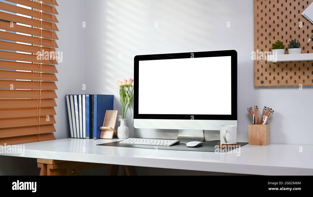 Modern home office with computer, books and office supplies on white ...