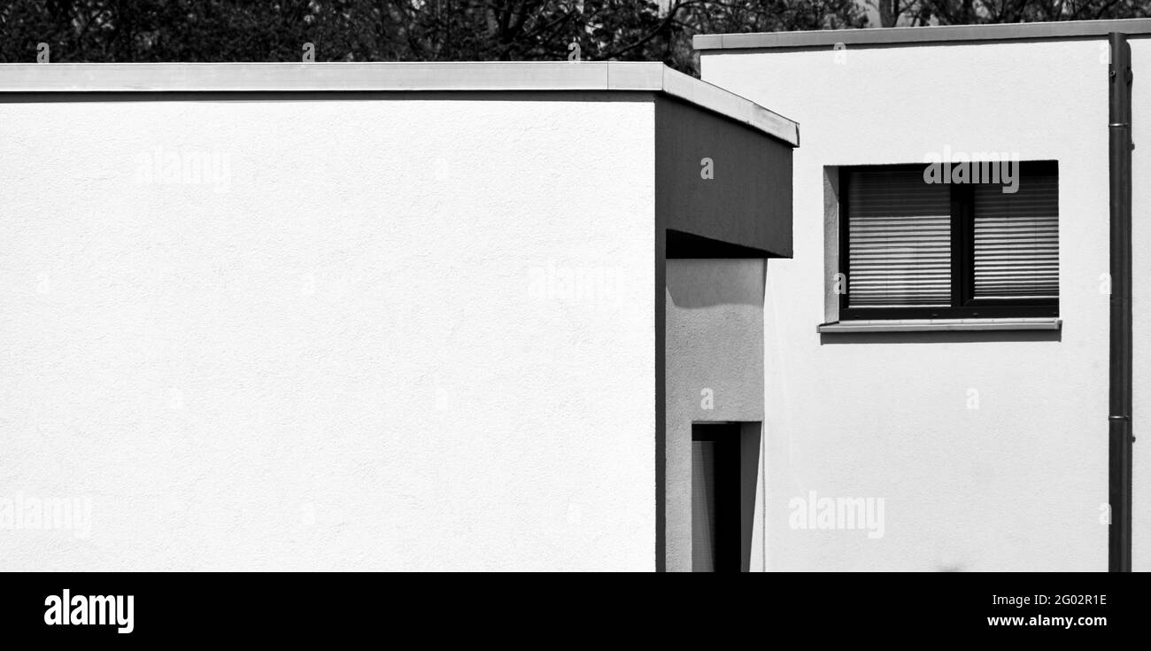 Minimalist architecture with rectangular dwellings with white walls ...