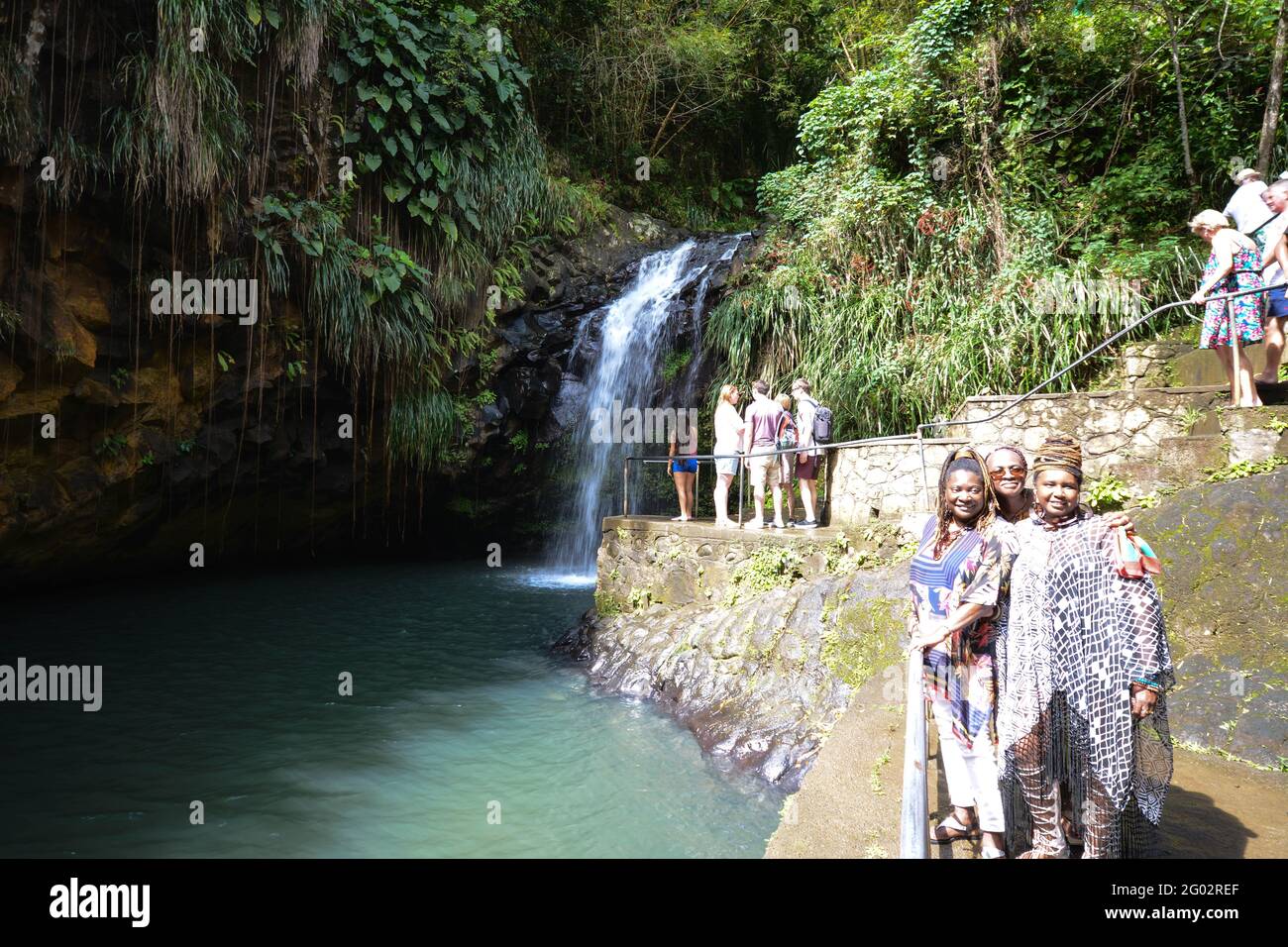 People in native dress at a Waterfall Carriacou Caribbean Island ...