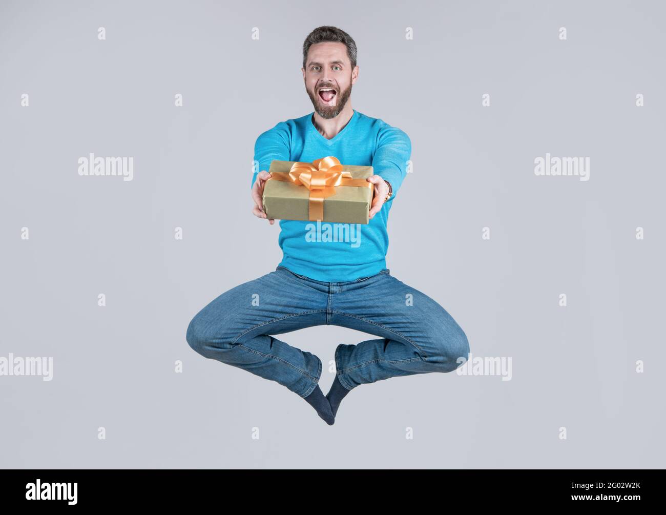 Surprised man present box hi-res stock photography and images - Alamy