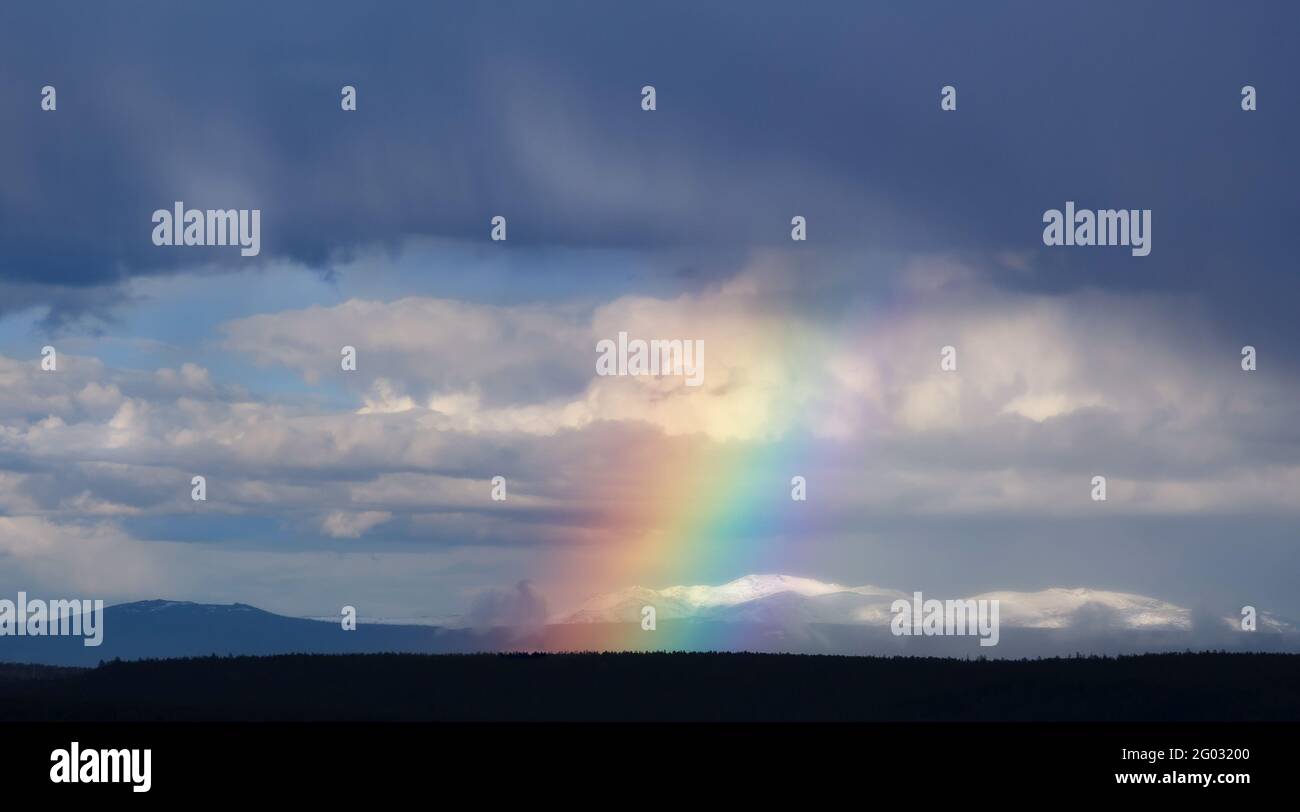 Part of the rainbow in inclement weather, against the background of ...