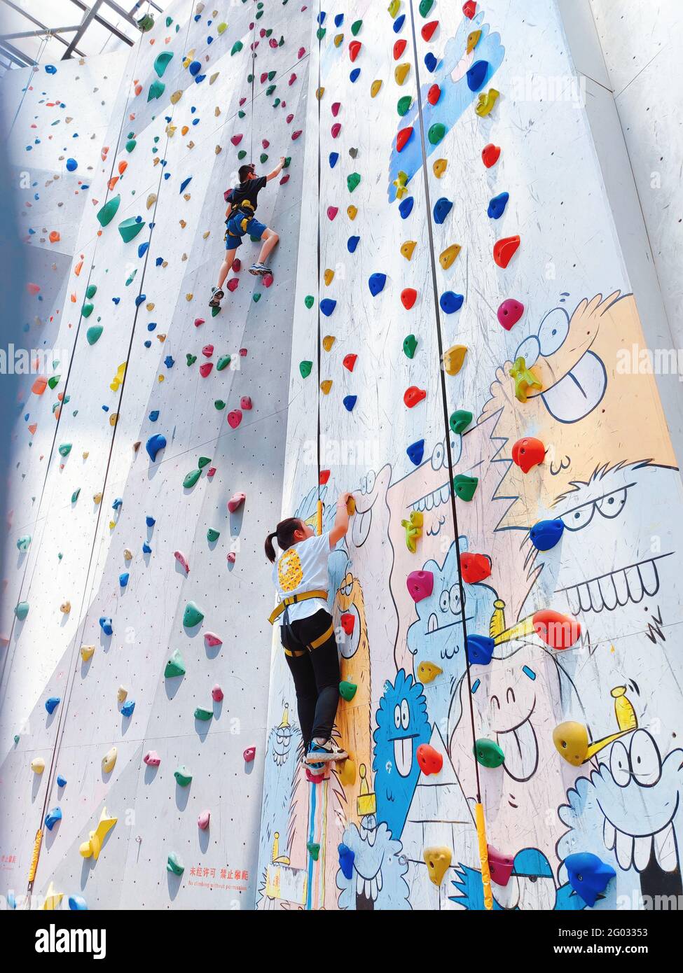 SHANGHAI, CHINA - MAY 30, 2021 - Children climb rocks at an indoor ...