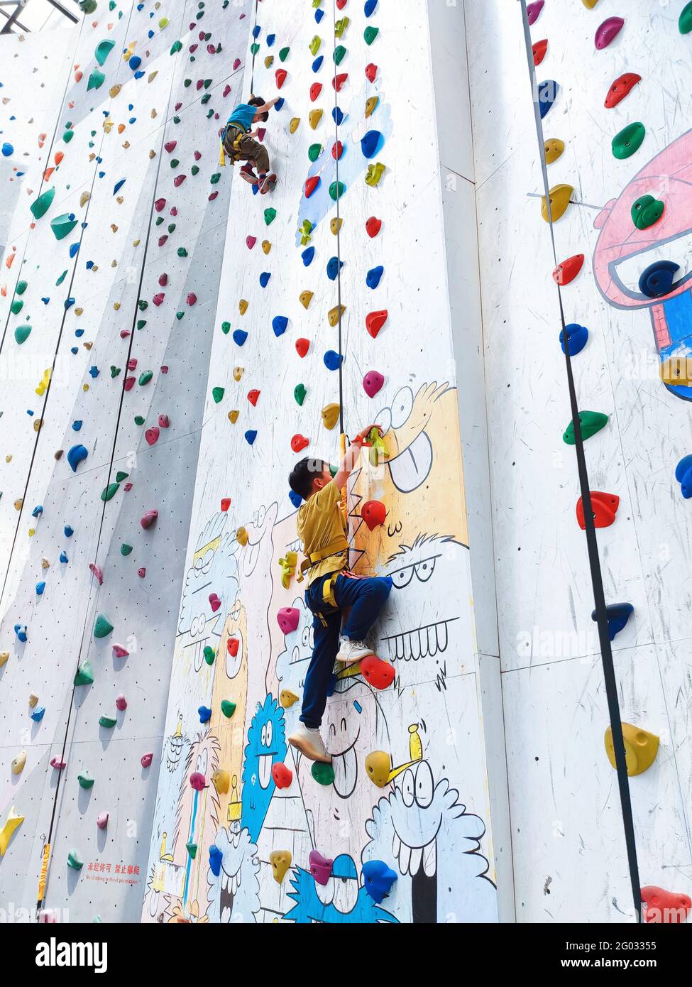 SHANGHAI, CHINA - MAY 30, 2021 - Children climb rocks at an indoor ...