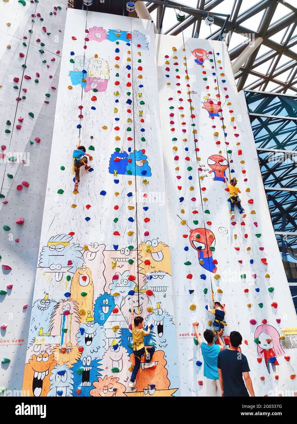 SHANGHAI, CHINA - MAY 30, 2021 - Children climb rocks at an indoor ...
