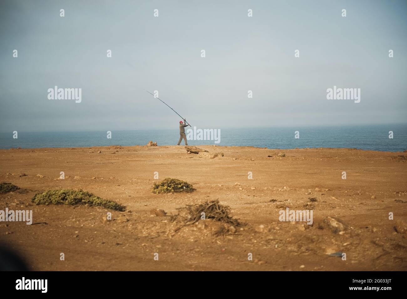 Fishing under the clean blue sky and ocean Stock Photo - Alamy