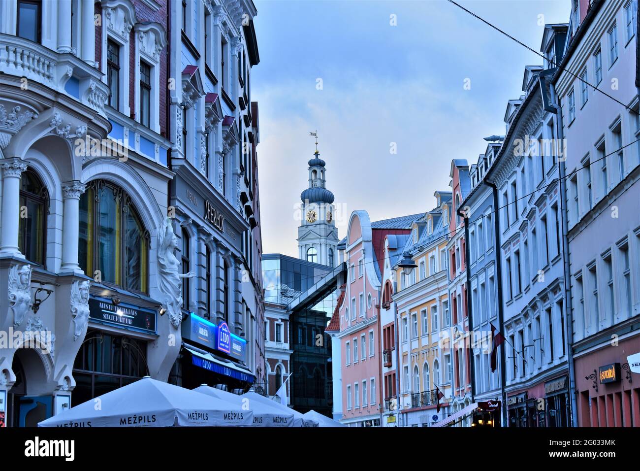 Old Town of Riga, street buildings and Old Riga Town Hall clock tower ...