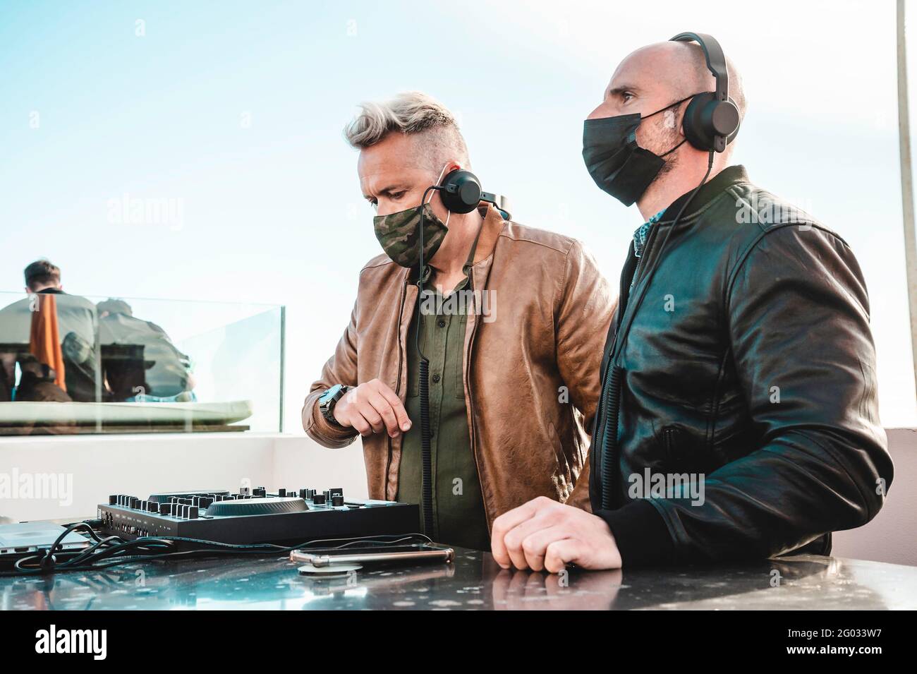 Disc jockeys playing music for tourist people at club party outdoor ...