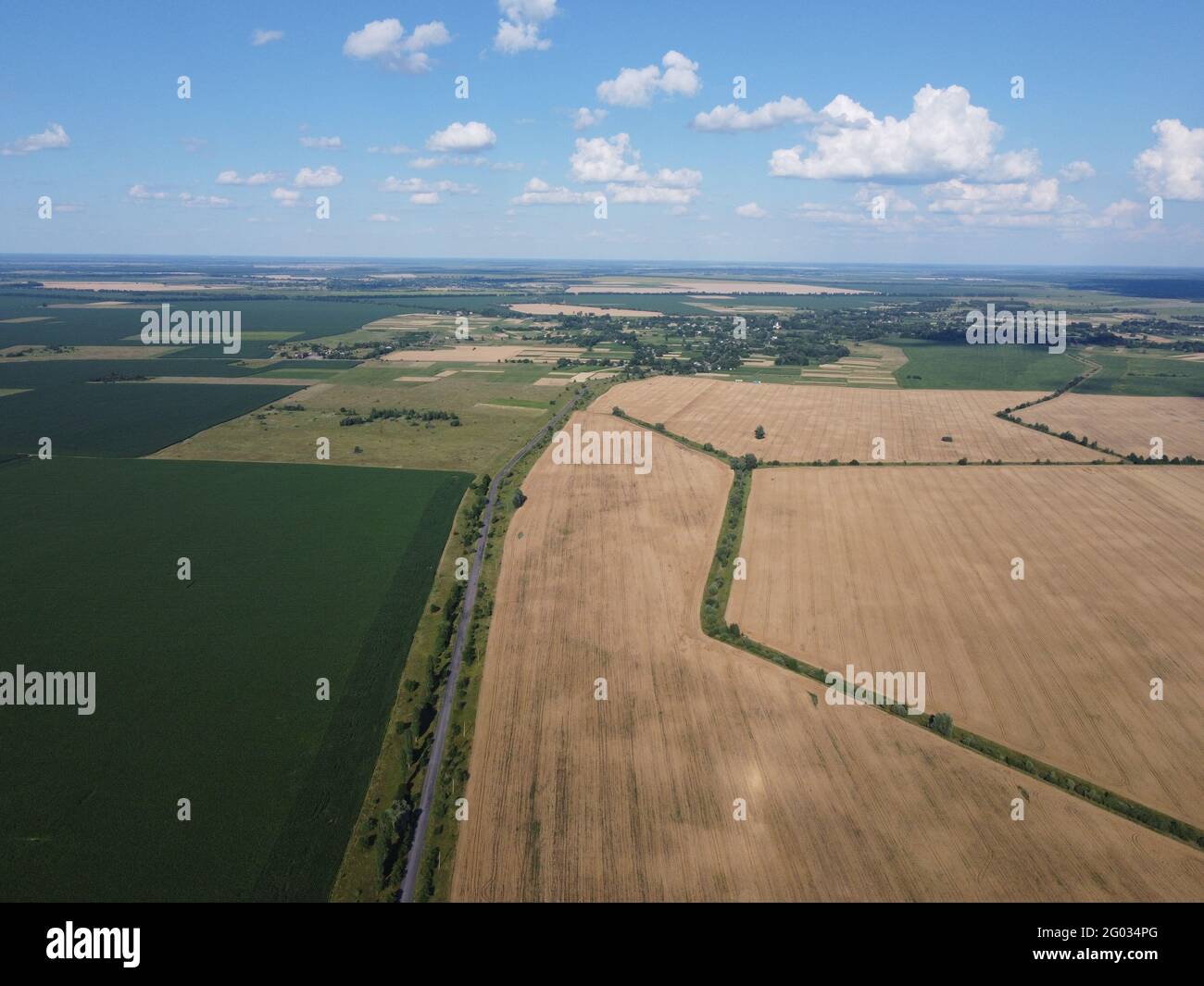 Beautiful agricultural landscape, open field with blue sky and white ...