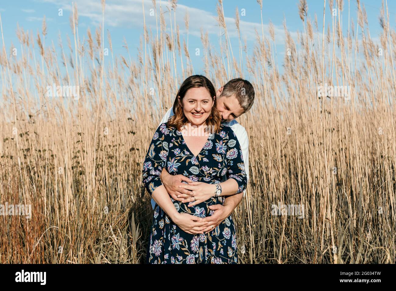 Beautiful young couple expecting a baby. Outdoor photo of happy parents ...