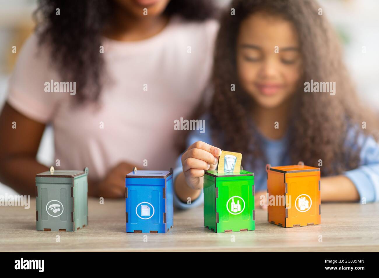 Eco-friendly family activities. Lovely little black girl with her ...