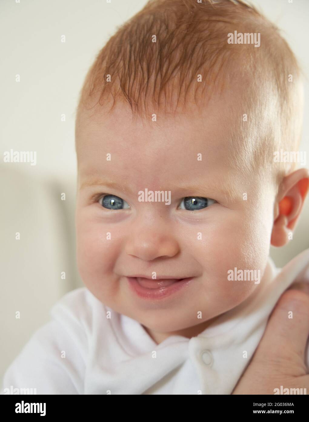 Facial expression on a three month old baby Stock Photo - Alamy