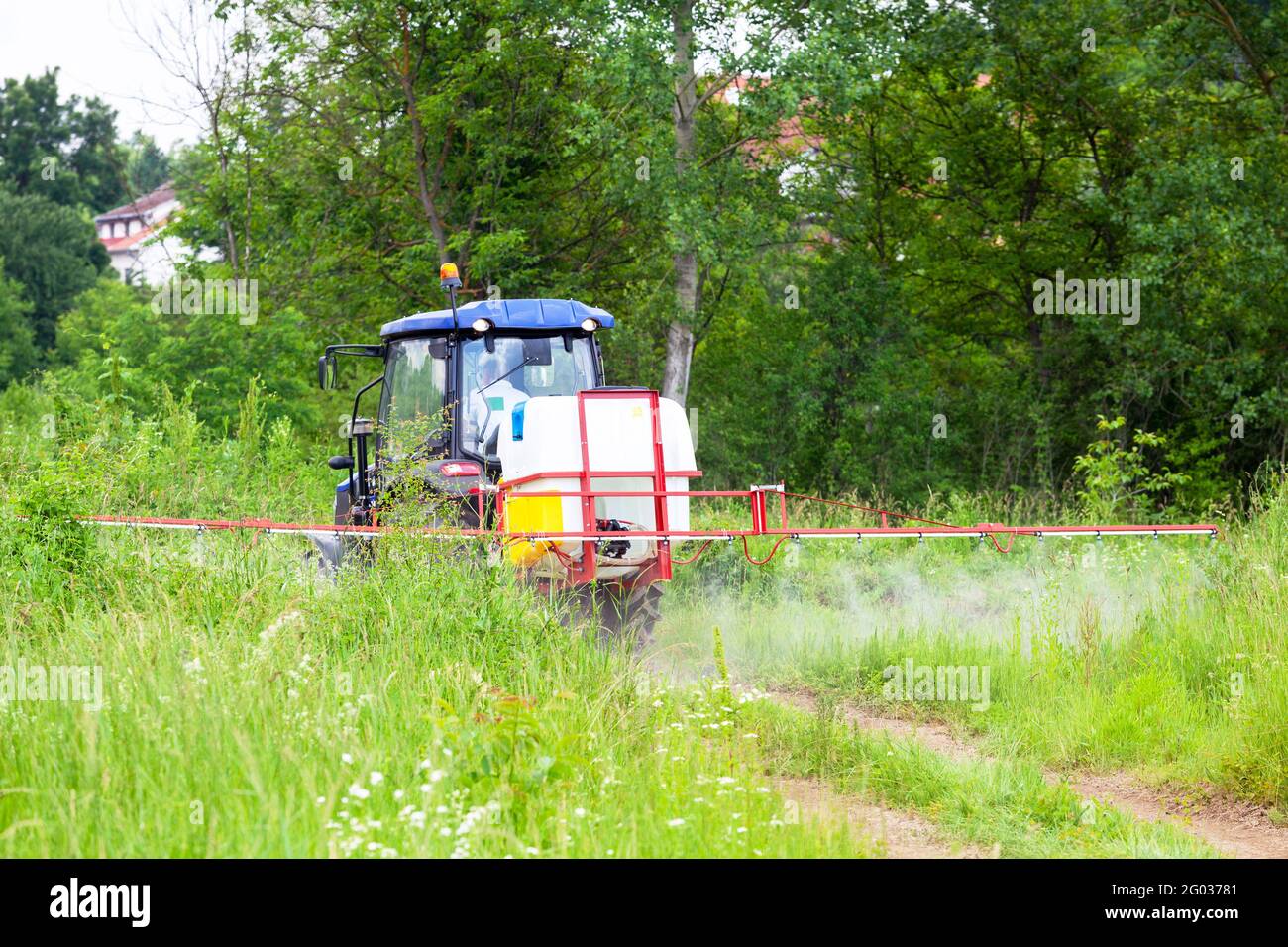 Pest control vehicle spraying herbicide on ragweed Stock Photo - Alamy