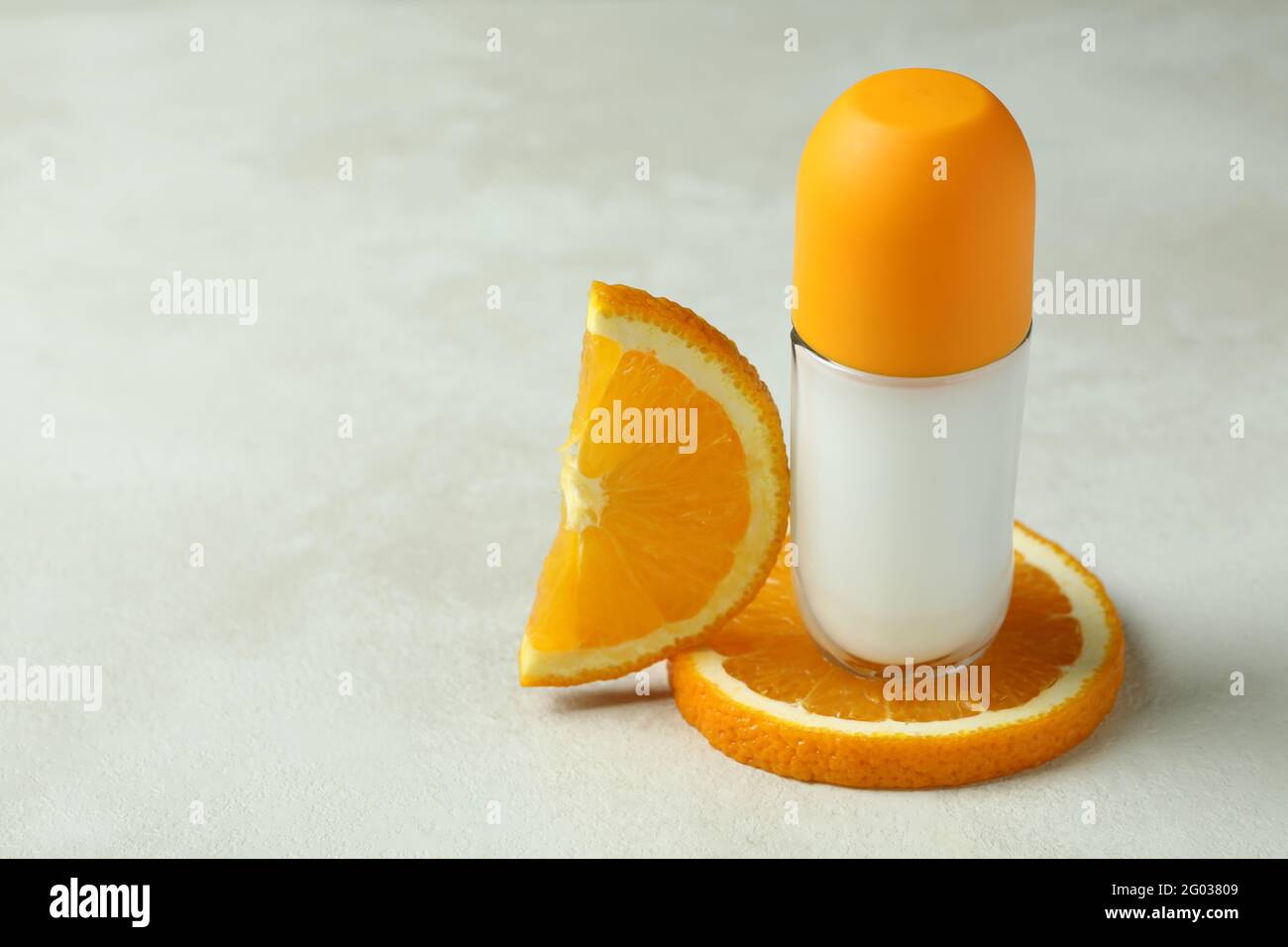 Blank orange deodorant on white textured background Stock Photo - Alamy