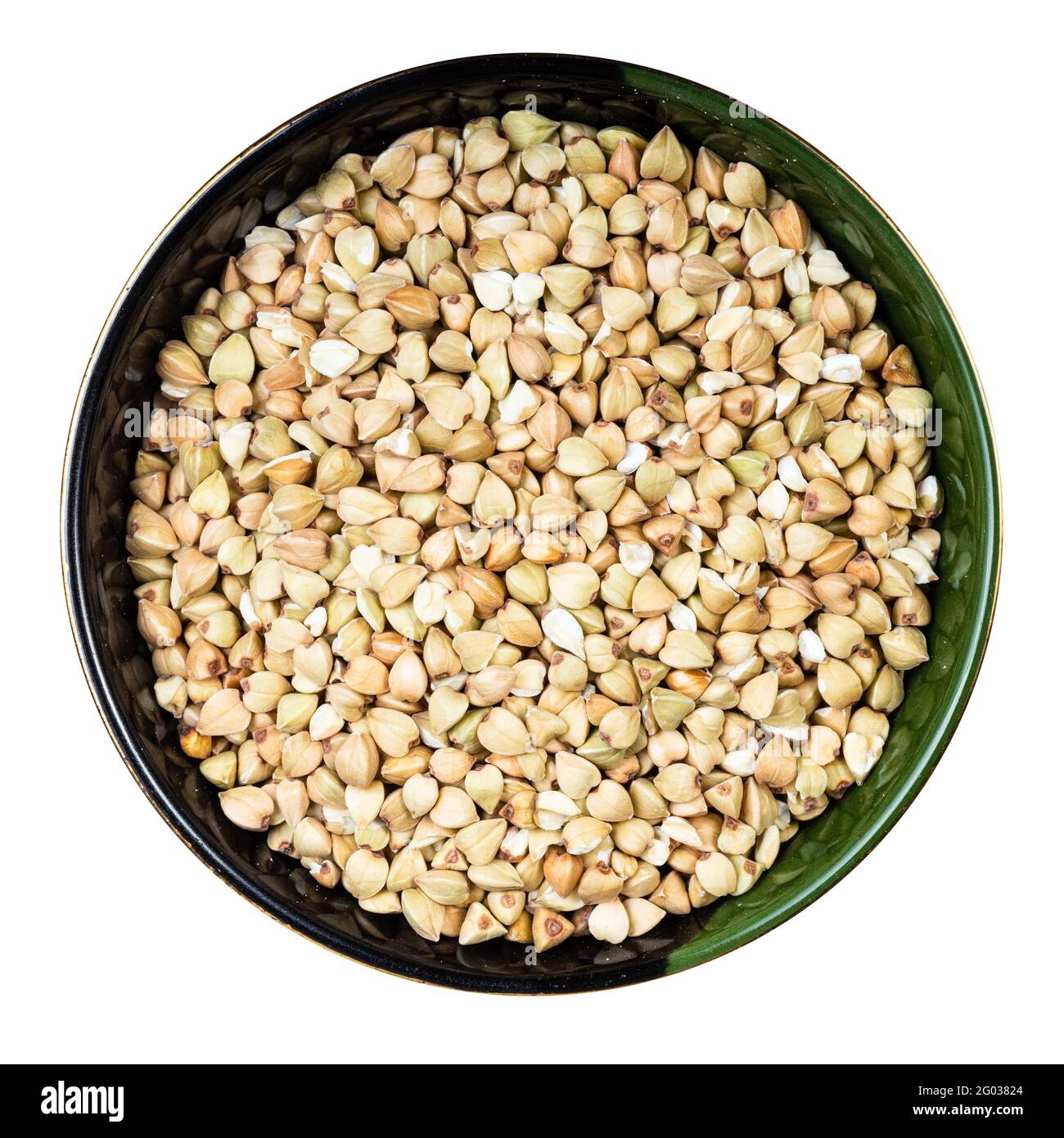 top view of raw green buckwheat in round bowl isolated on white ...