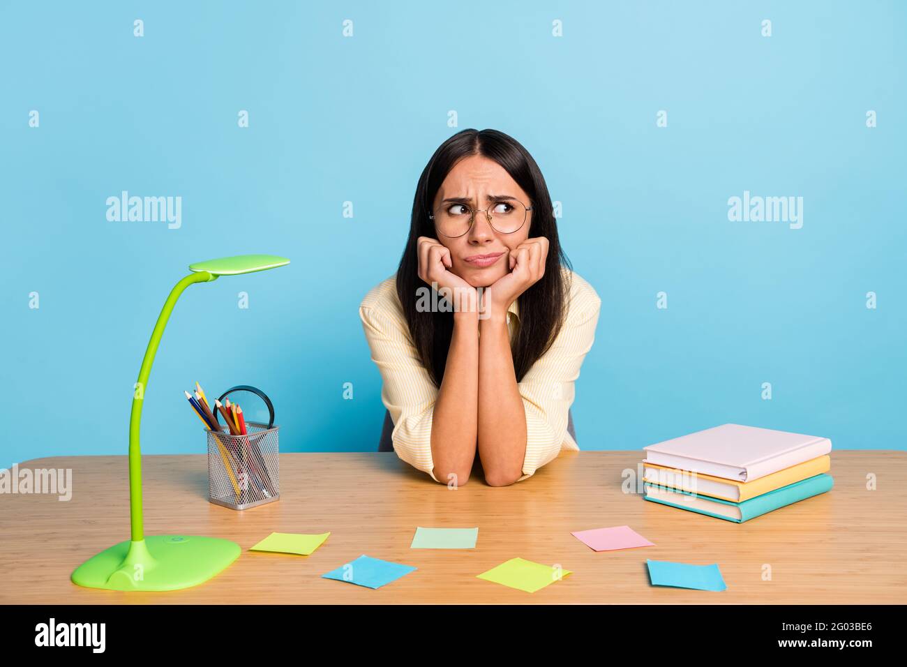 Photo of tired bored young businesswoman look empty space sit table bad ...