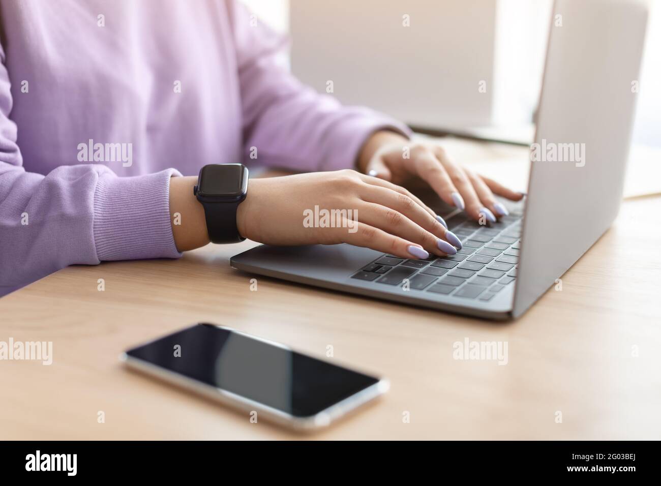 Freelancer sitting table typing message hi-res stock photography and ...