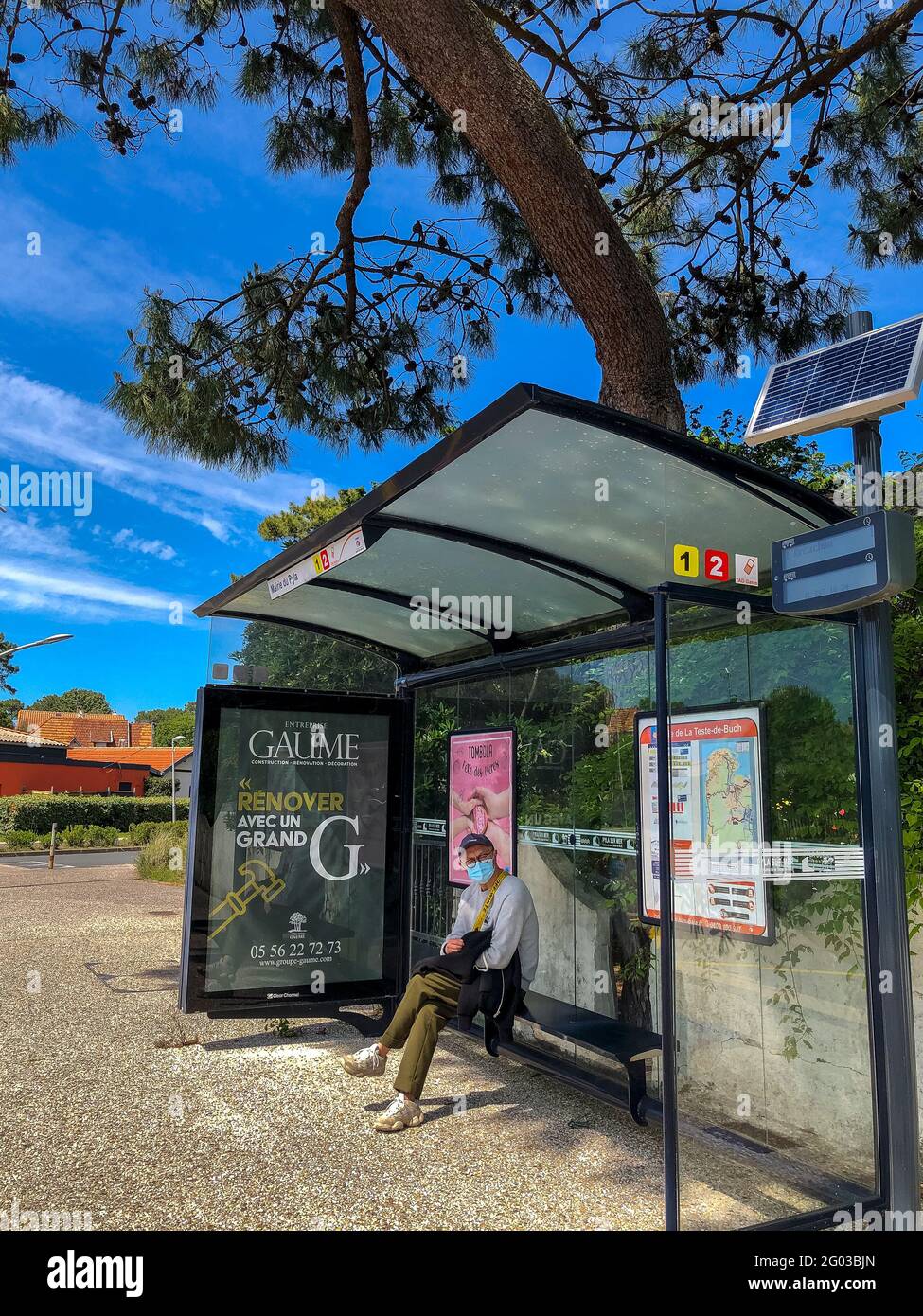 Arcachon, France, Chinese Tourist with mask, Waiting for Bus on Street ...