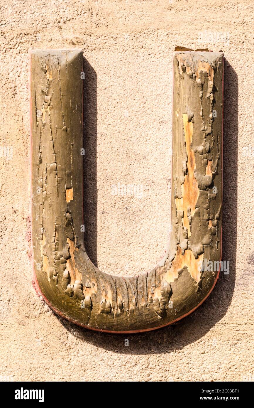Weathered gilt capital letter U Stock Photo - Alamy