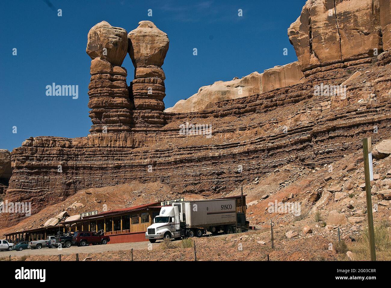 Navaho Twins, Twin Rocks Trading Post and semi truck below, Bluff, Utah ...