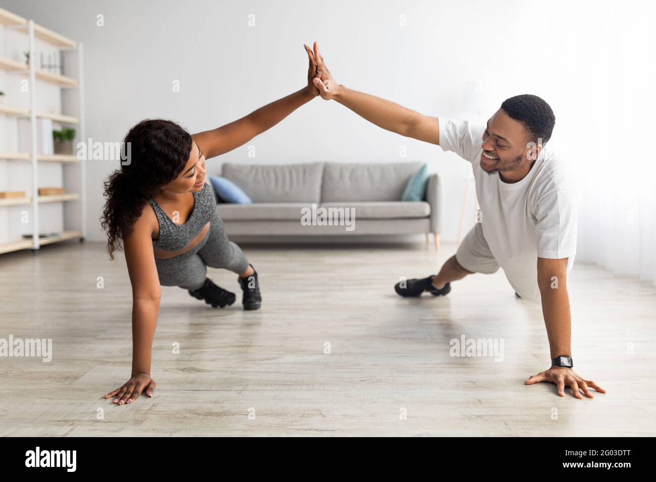 Woman high fiving husband hi-res stock photography and images - Alamy