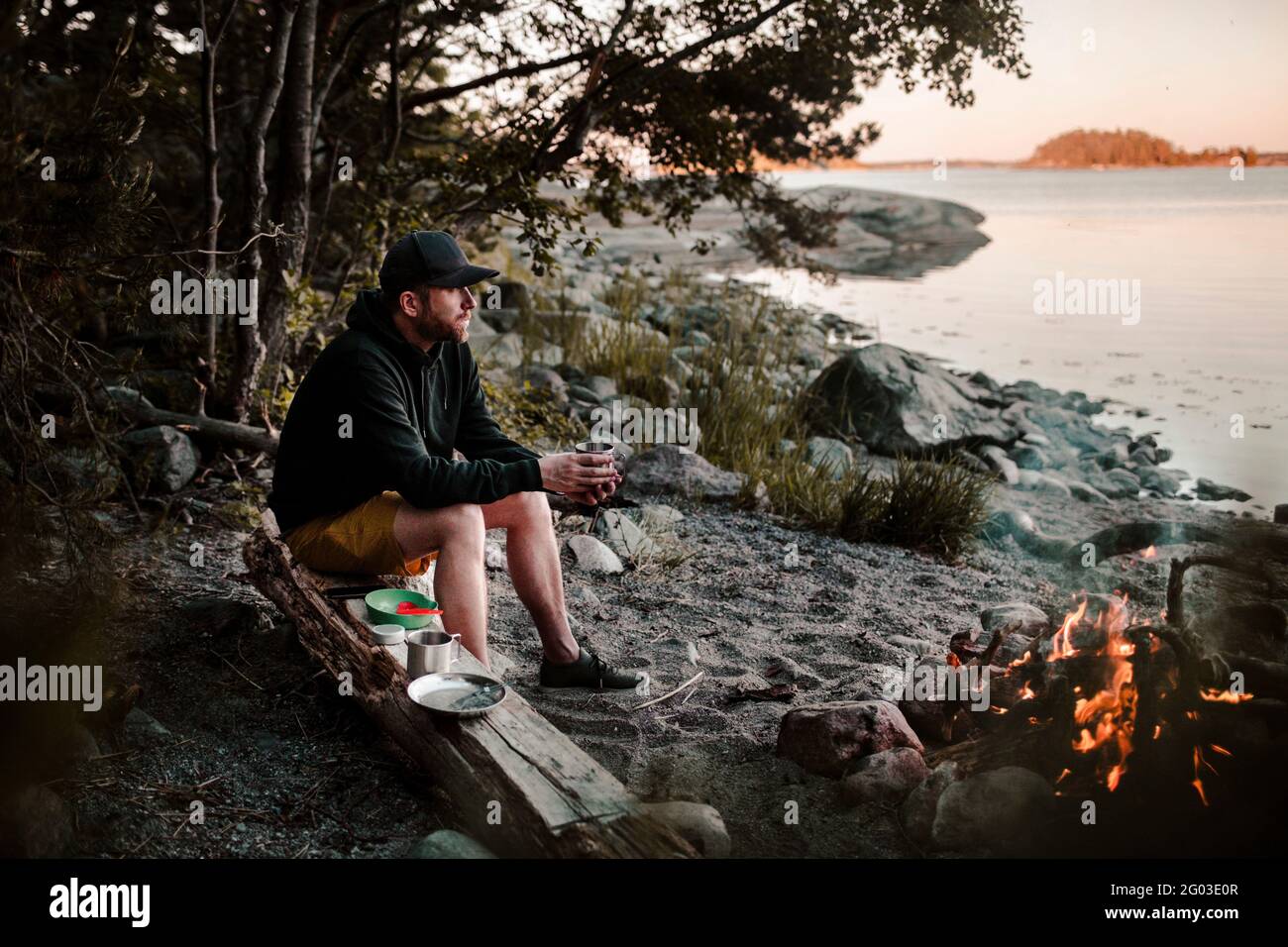 Man sitting on log on hi-res stock photography and images - Alamy
