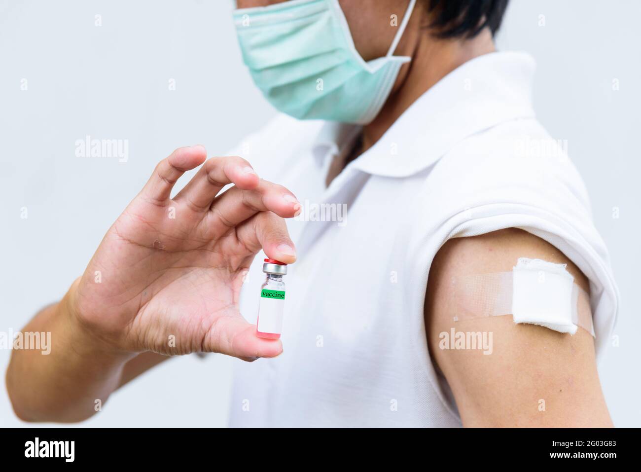 asian man wear mask and get vaccinated of covid-19 Stock Photo - Alamy