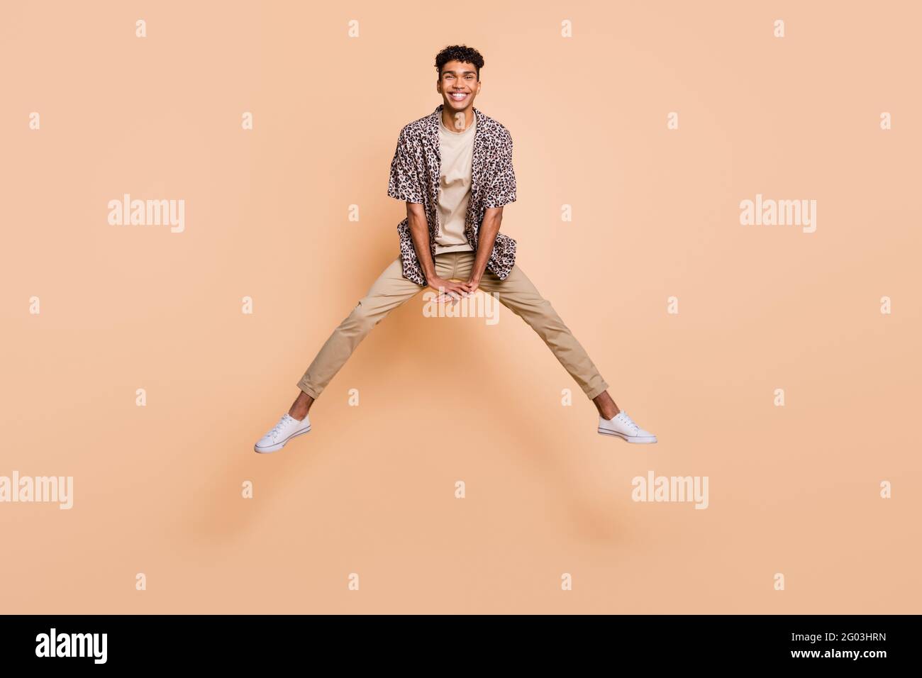 Full size photo of carefree dark skin person jumping high have fun ...