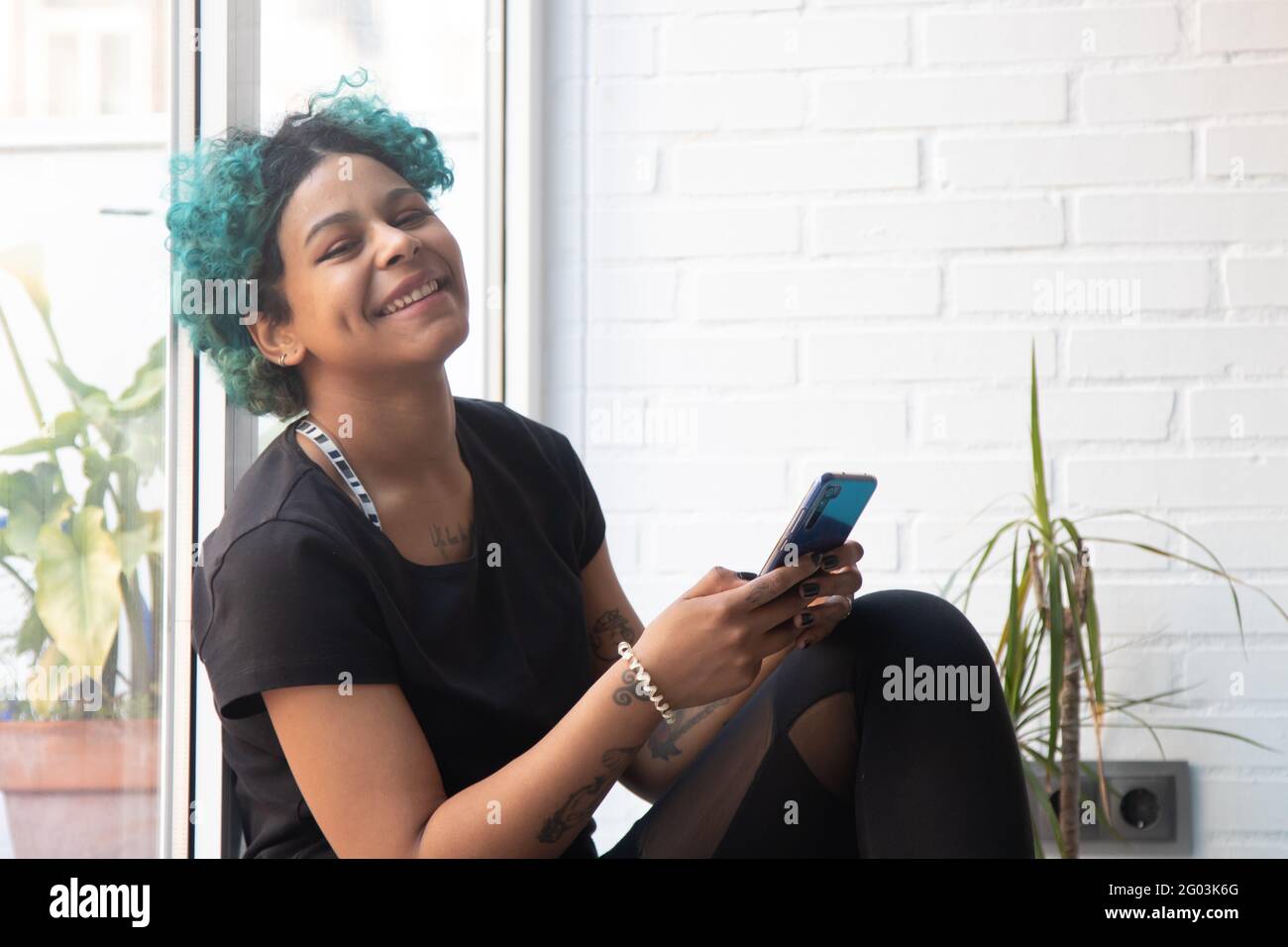 girl or woman with mobile phone at home Stock Photo - Alamy