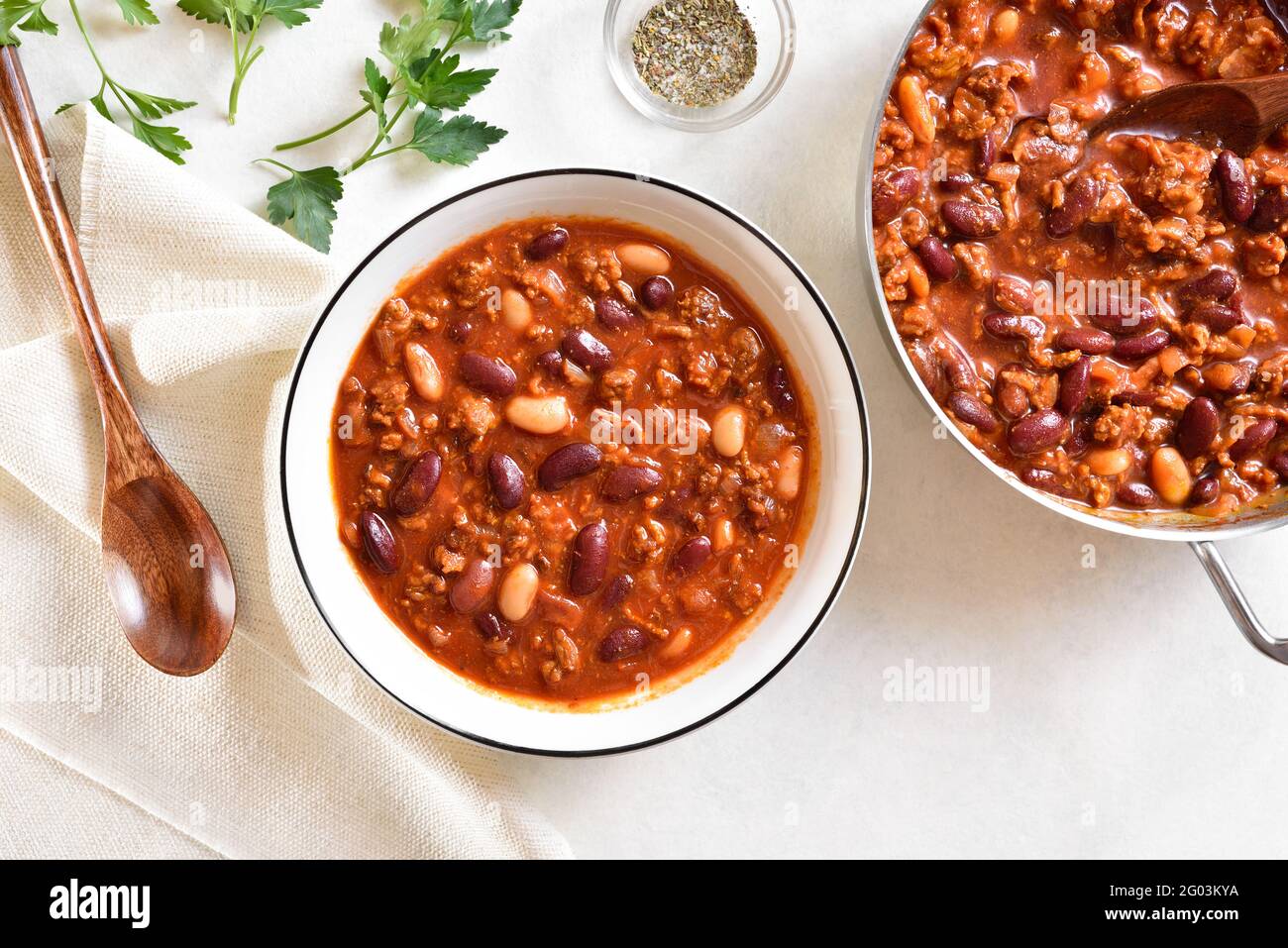 Cowboy beans with ground beef, jalapeno pepper and bacon over light ...