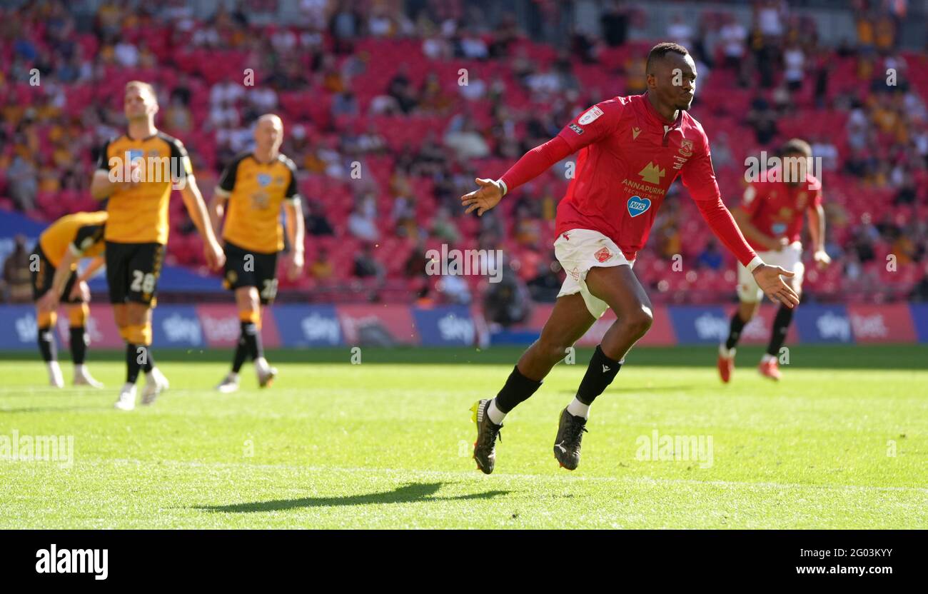 Morecambe's Carlos Mendes Gomes celebrates scoring their side's first ...