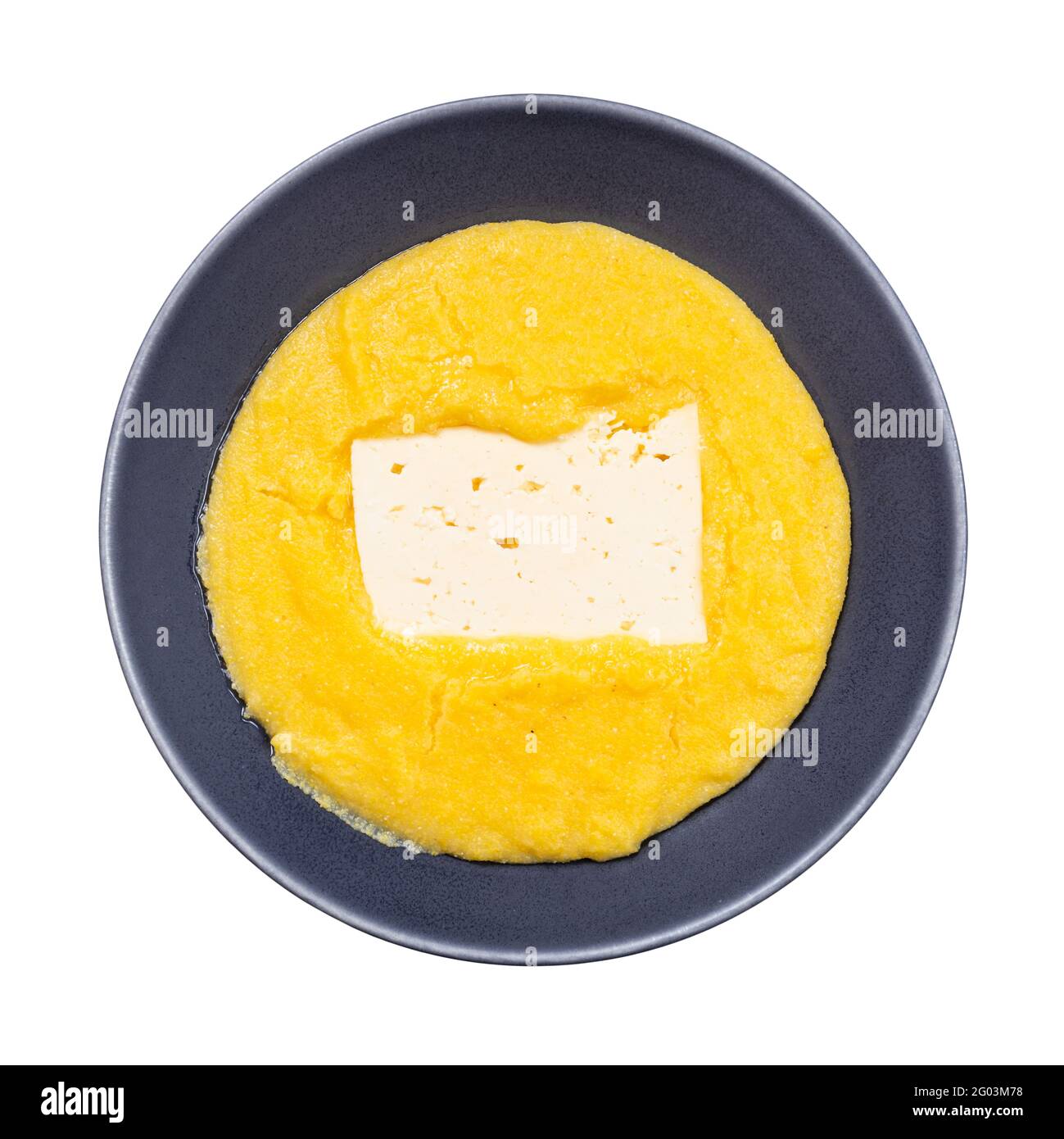 top view of cooked maize porridge with piece of brined cheese in gray ...