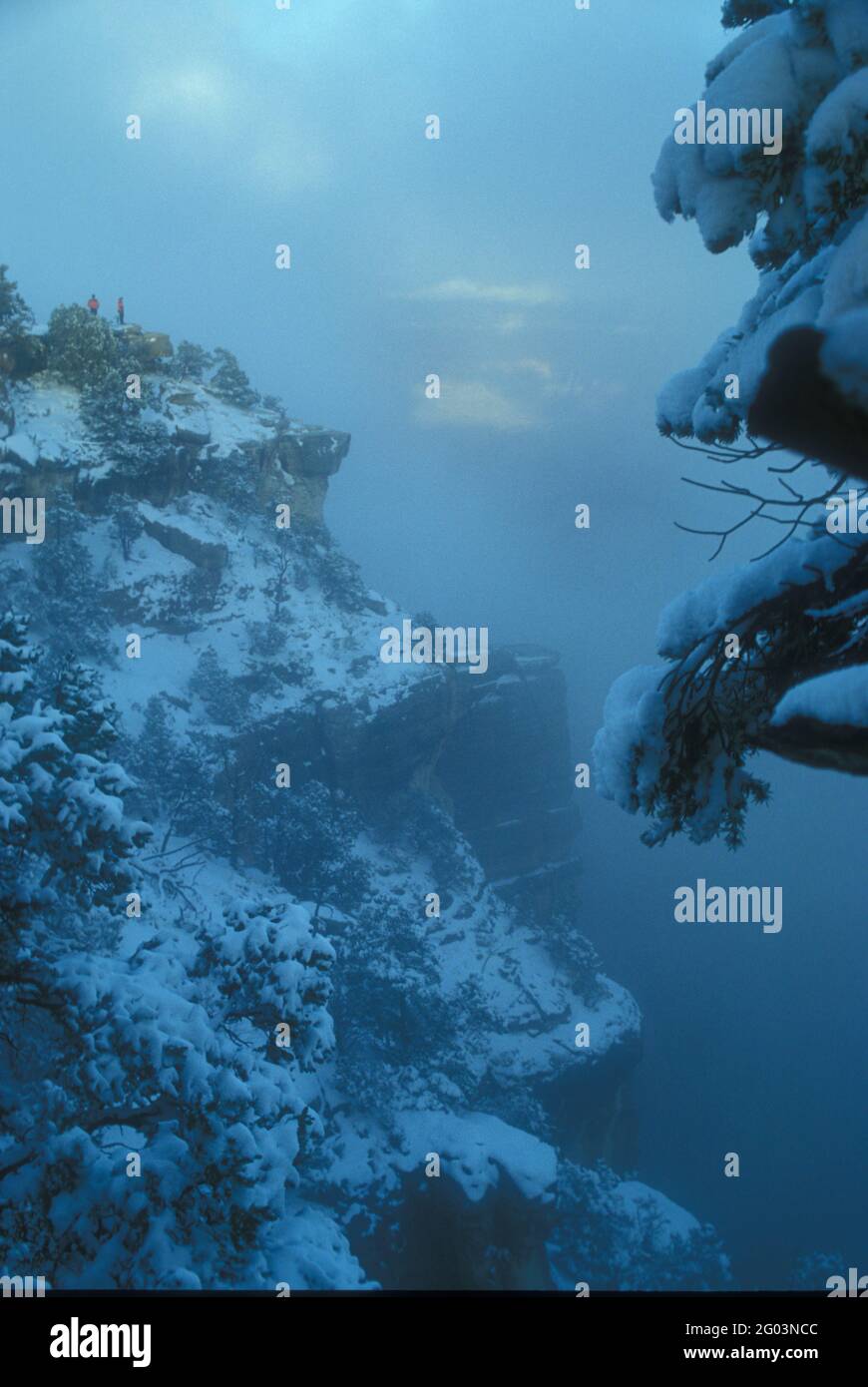 Grand Canyon, Two Hikers looking into the Foggy Abyss, Winter Snow ...