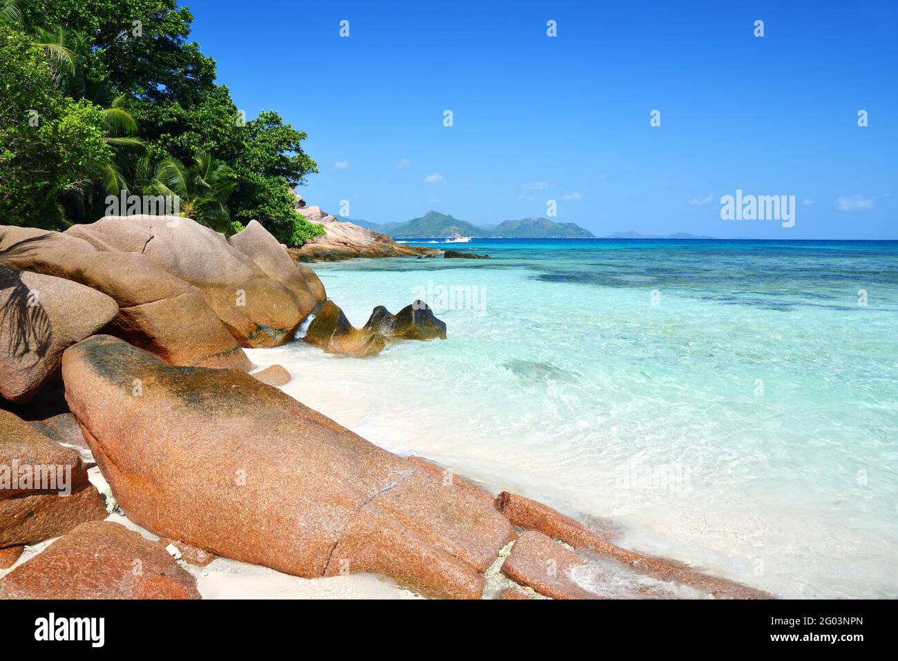 Coast with big granite boulders of the island La Digue, Anse Severe ...