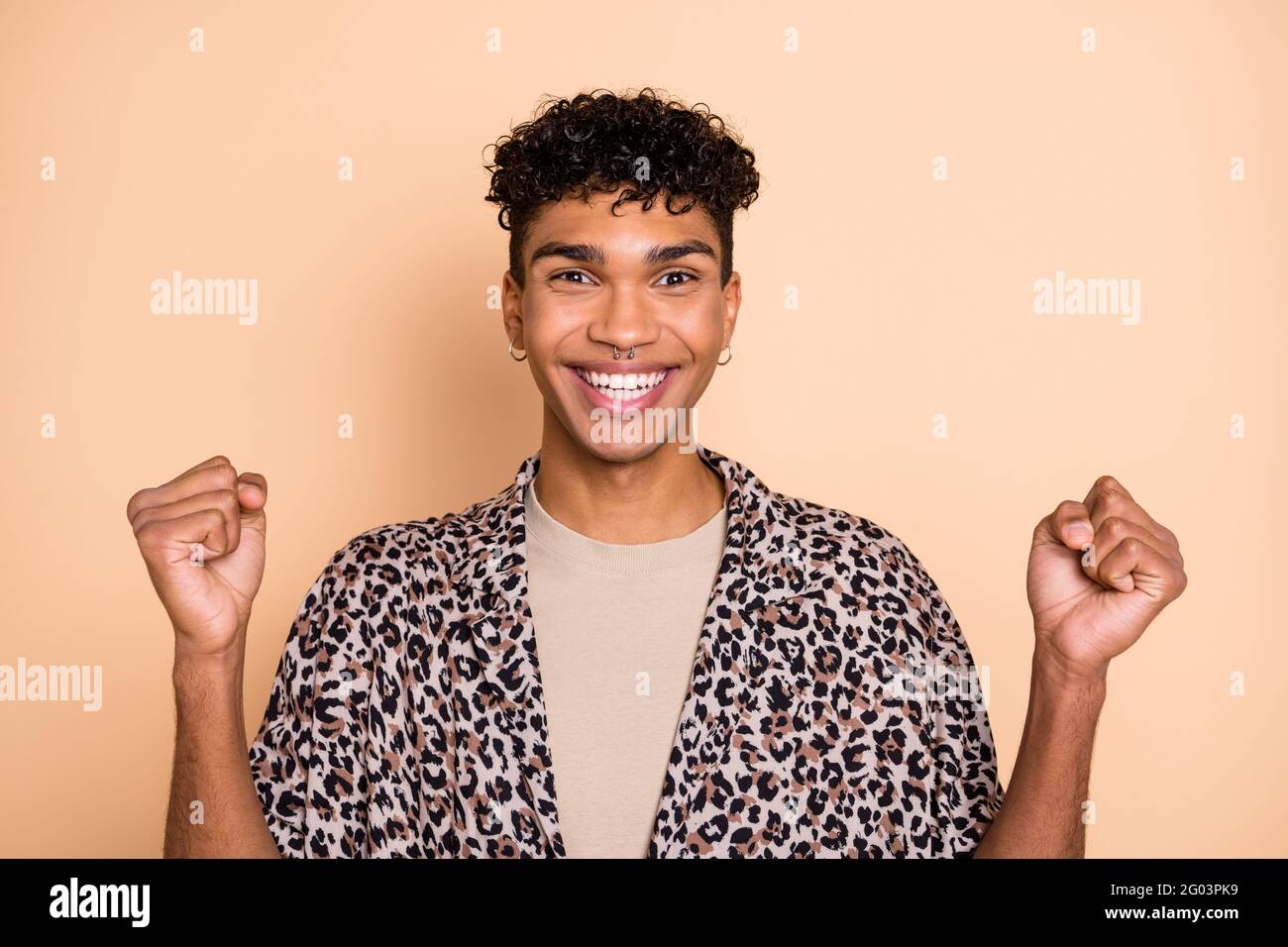 Portrait of brunet hooray guy hands fists wear modern shirt isolated on ...