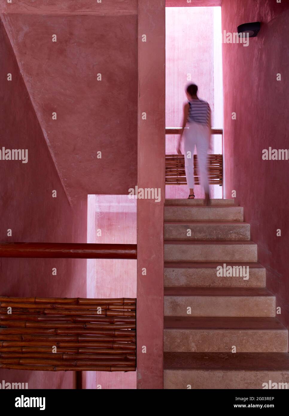 Interior of public corridor and stairs with adult figure. Tulum ...