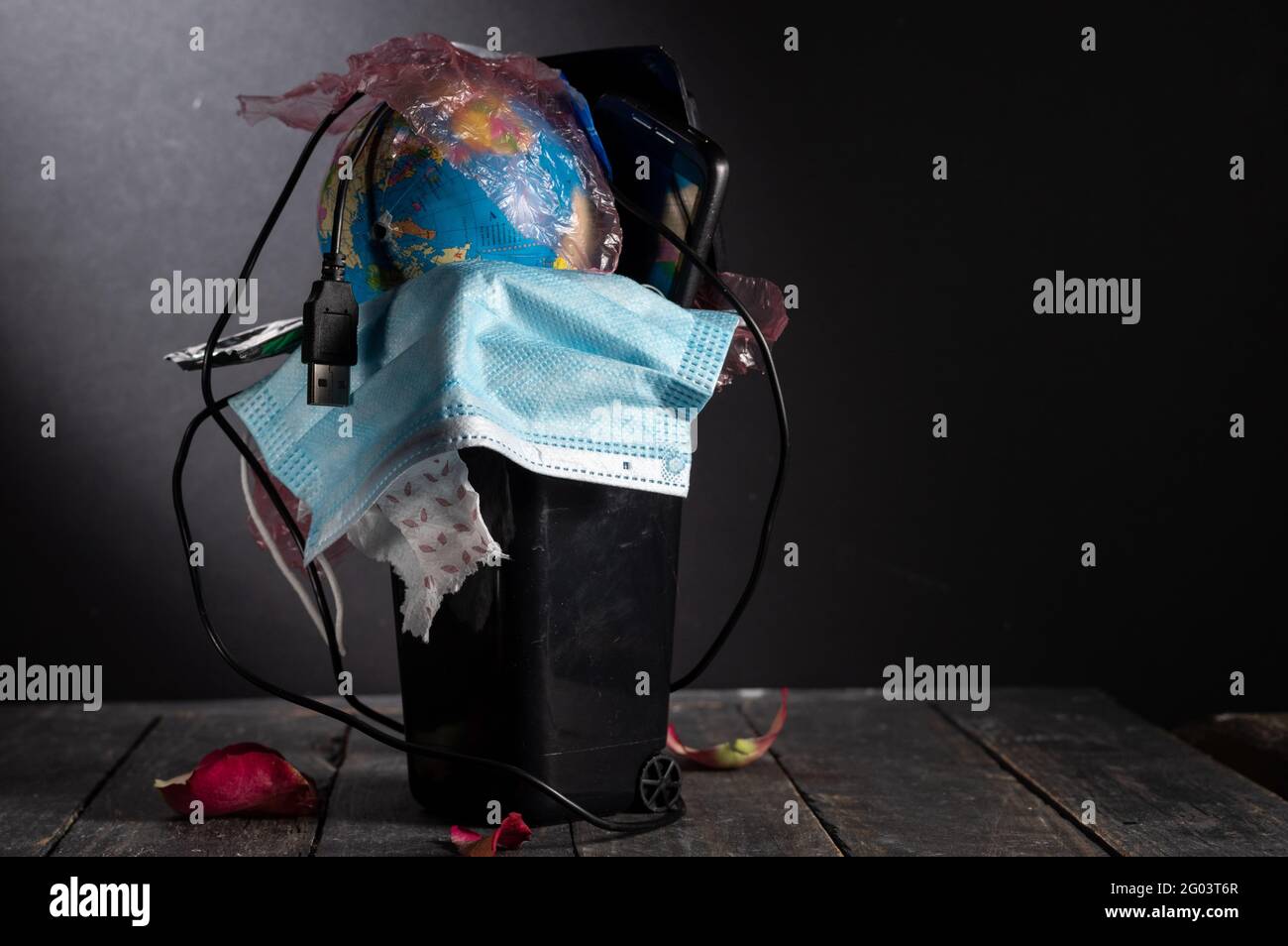 Garbage container with garbage. Various garbage in the bin. A beam of ...