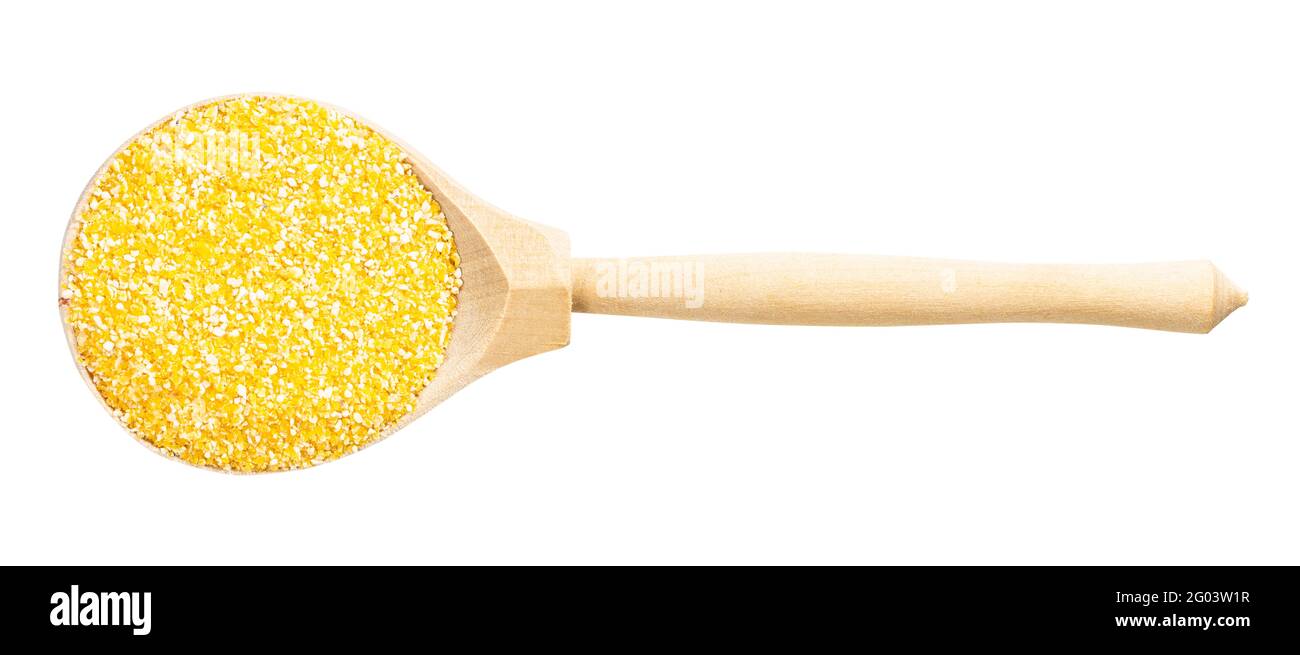 top view of wood spoon with uncooked coarse maize cornmeal isolated on ...