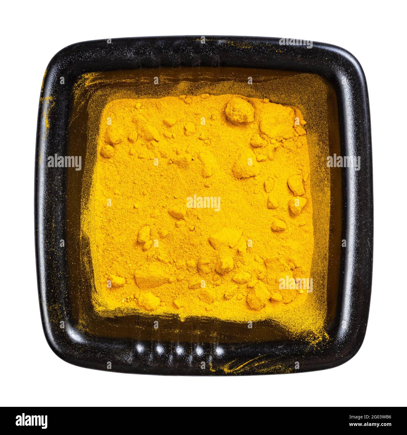 Turmeric powder in black Cut Out Stock Images & Pictures - Alamy