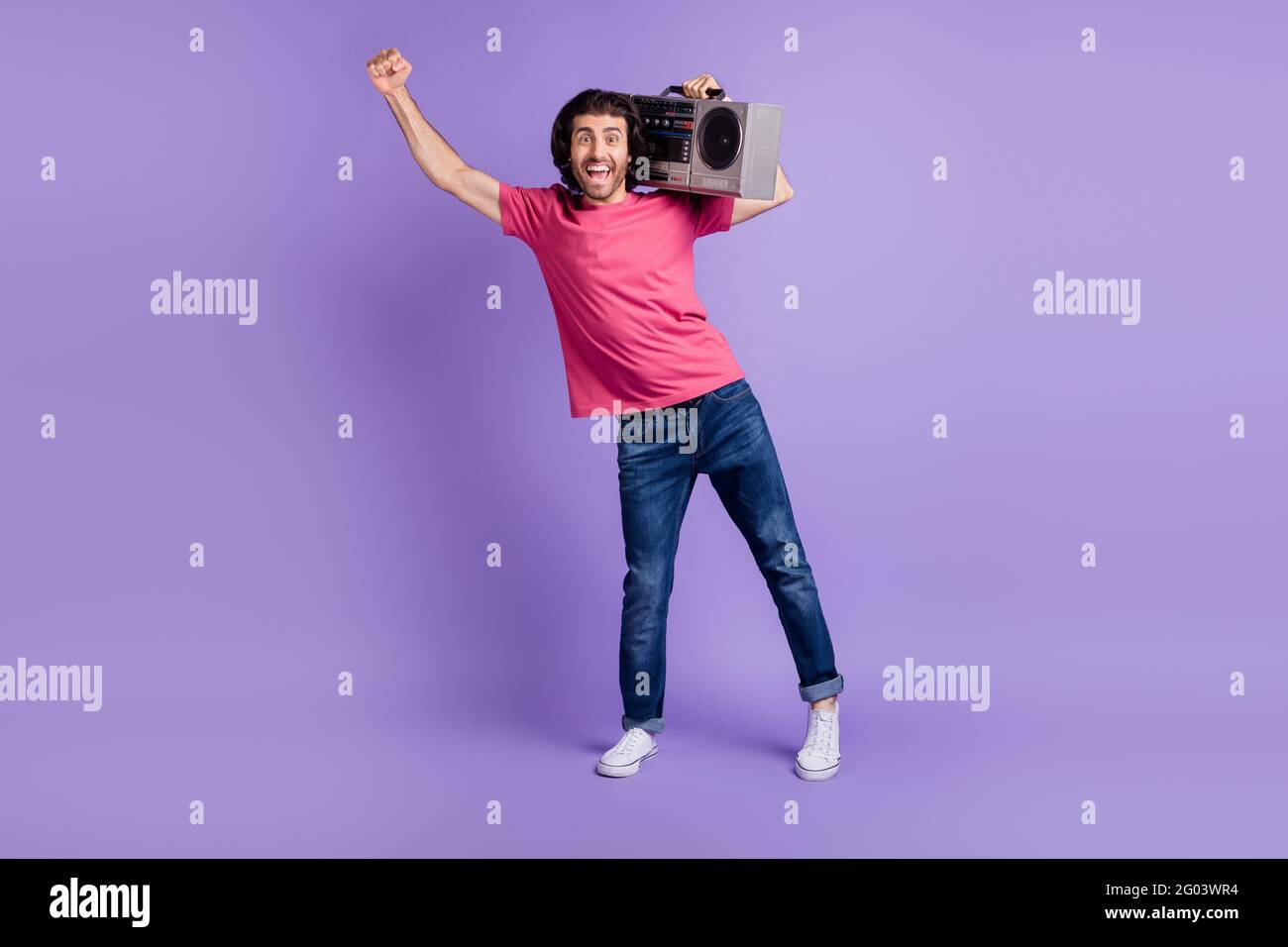Full size photo of optimistic nice brunet guy listen boom box wear pink ...