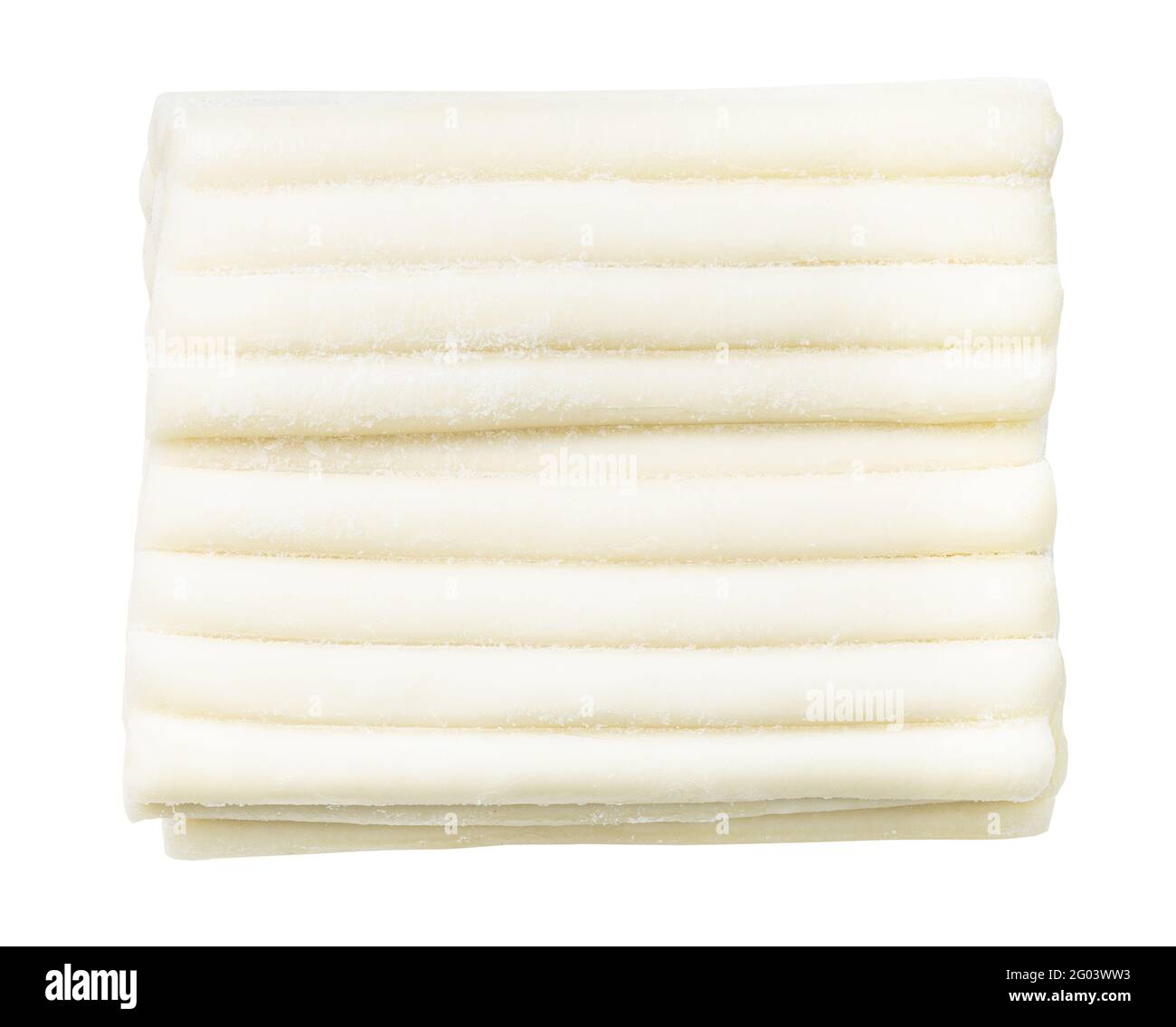 top view of raw frozen tteokbokki (korean rice cakes) isolated on white ...